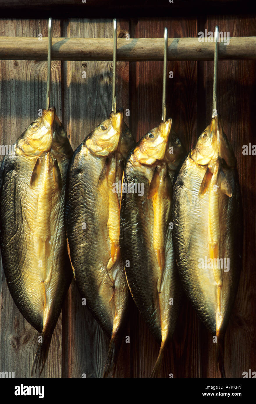 Food smoked fish kippers on hooks Stock Photo - Alamy