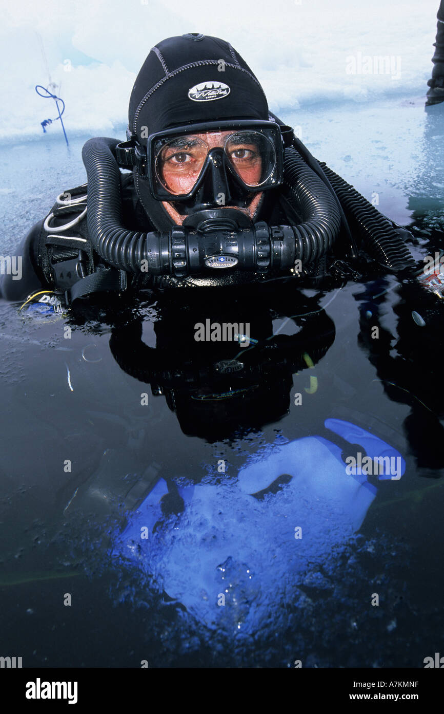 underwater photographer ready to dive under the ice Canada Arctic ...