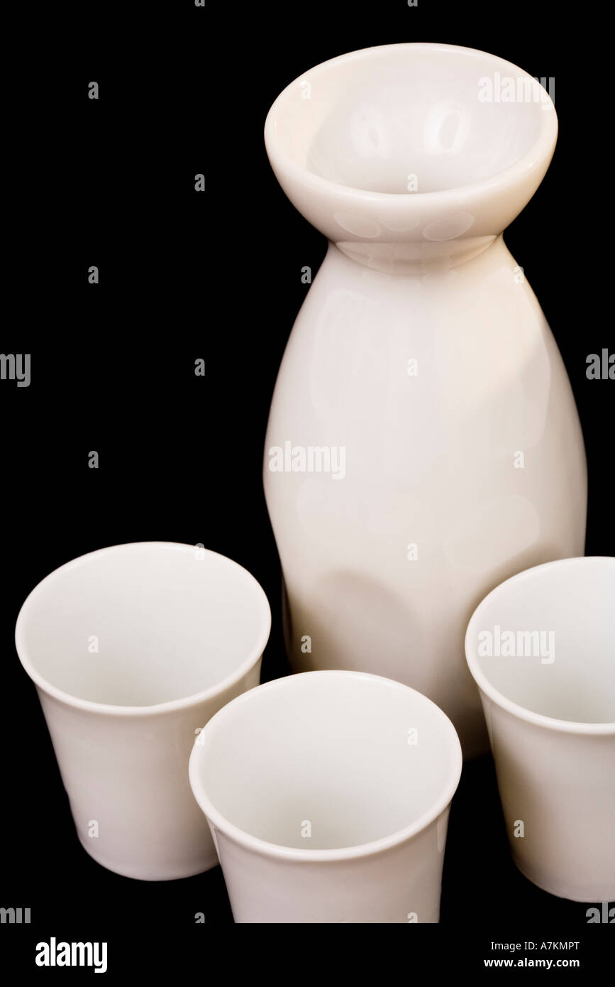 Sake pitcher isolated on black Stock Photo - Alamy