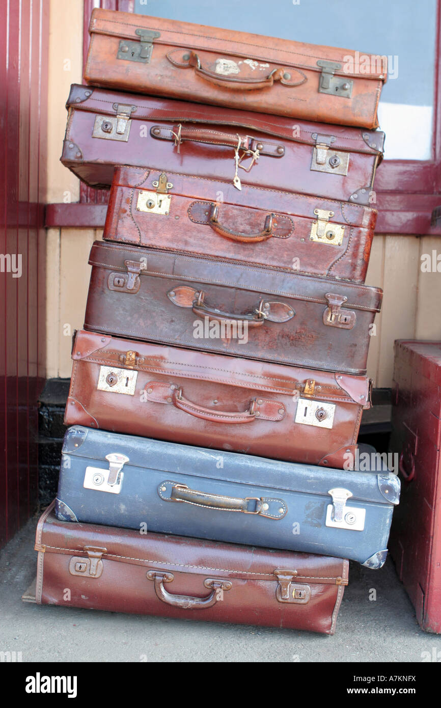 A stack of battered old suitcases Stock Photo - Alamy