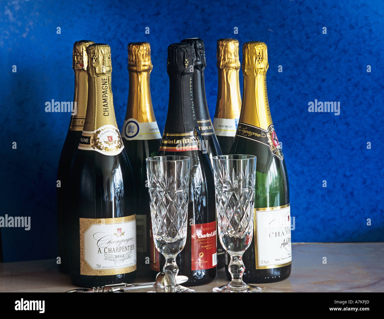 STUDIO March Champagne bottle two champagne flutes and a cork screw ...