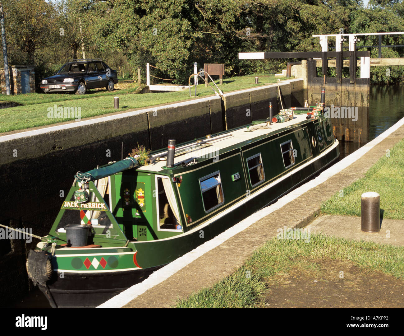 SUTTON GREEN SURREY UK A green Canal boat waiting for Triggs Lock on ...