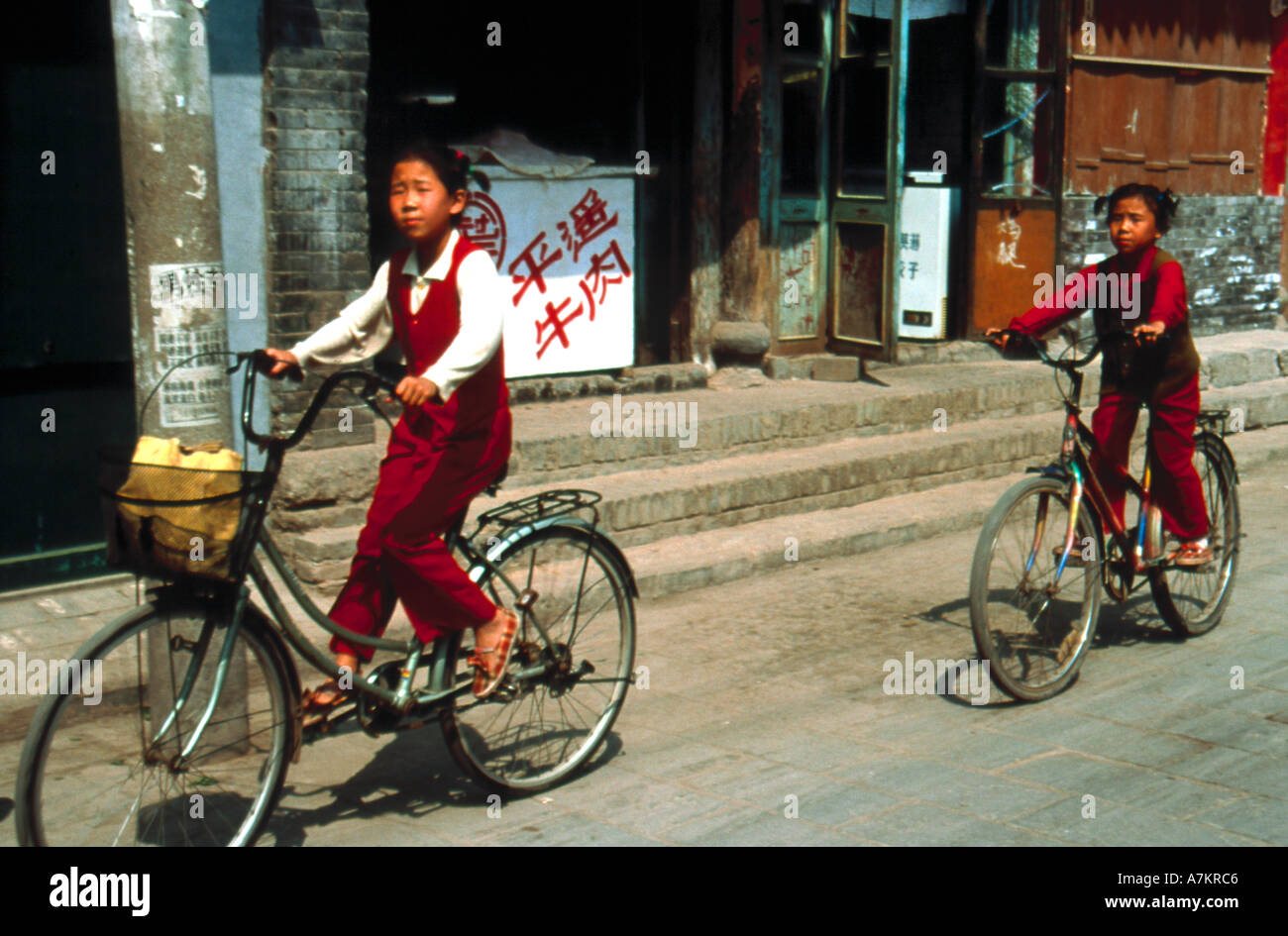Chinese girls on bicycles Stock Photo - Alamy