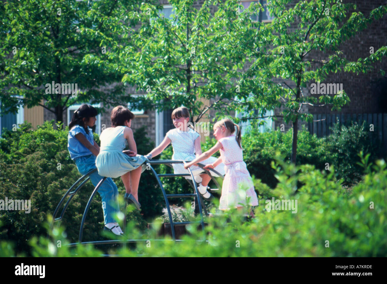 Four girls talking on the playground Stock Photo - Alamy