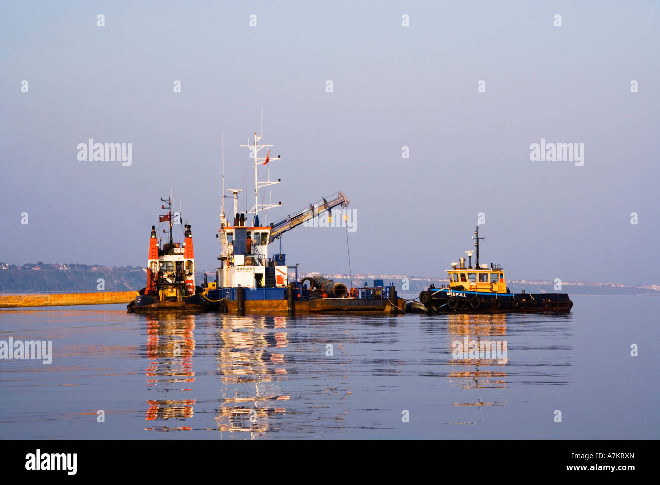 Tug boats. Sand dredging off Bournemouth coast. Dorset. UK Stock Photo ...