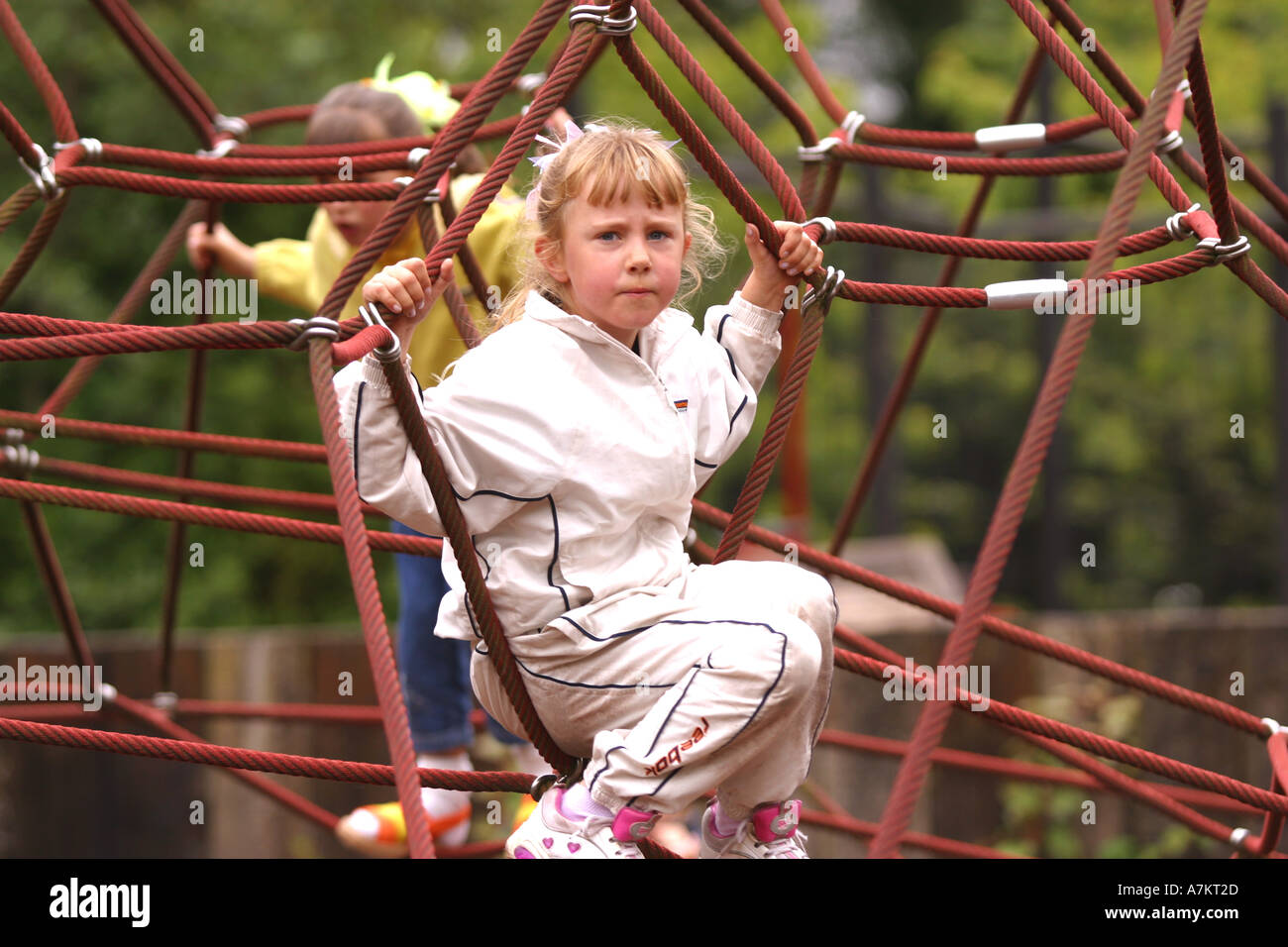 Girl in climbing frame in Northern Ireland Stock Photo - Alamy