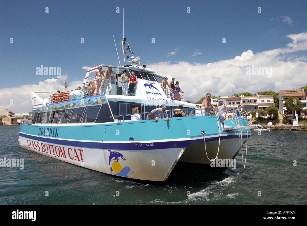 A Catamaran glass bottomed tourist boat at Porto Petro on the Spanish ...