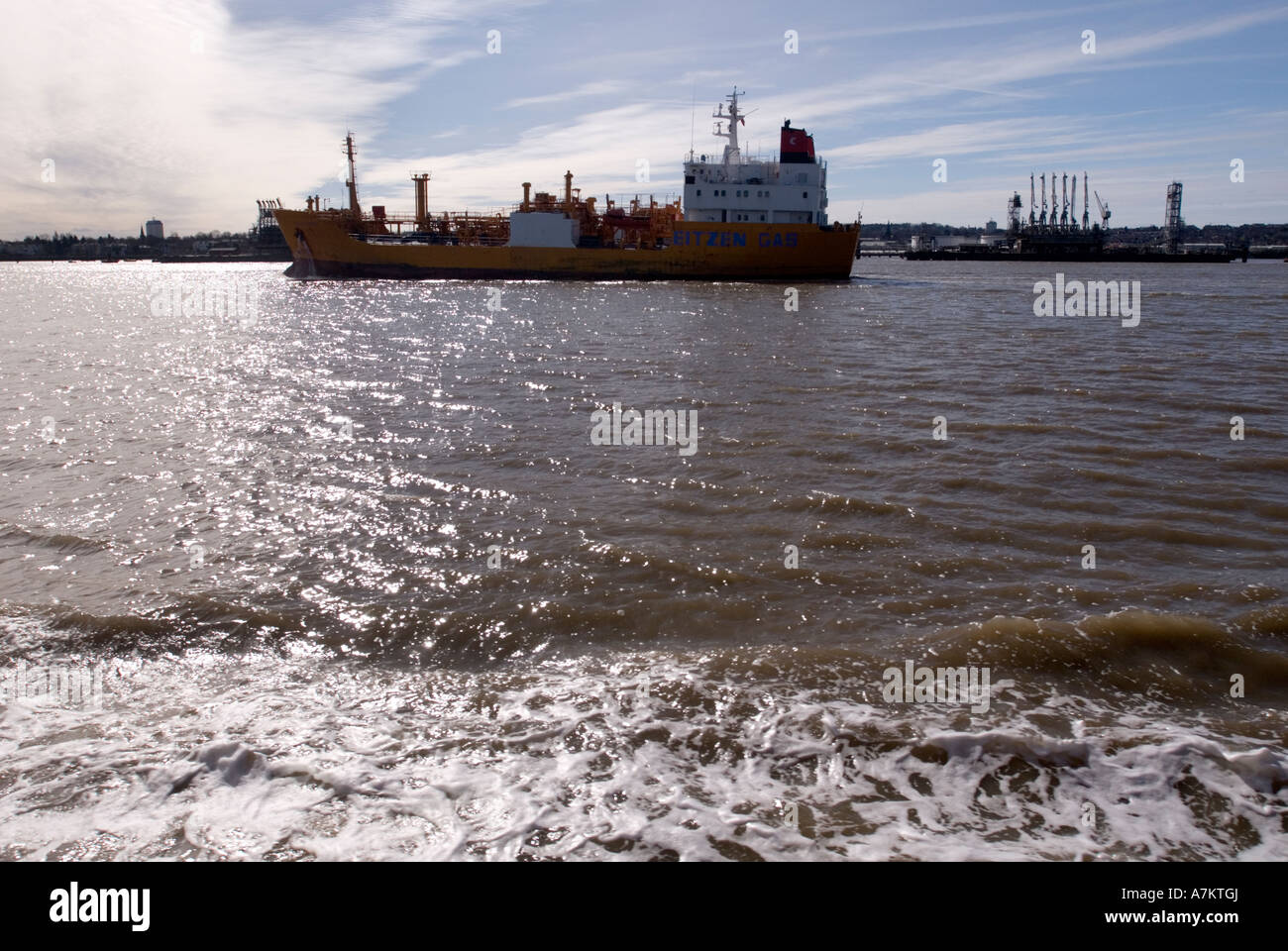 A gas tanker pictured in the River Mersey passing the Tranmere oil ...