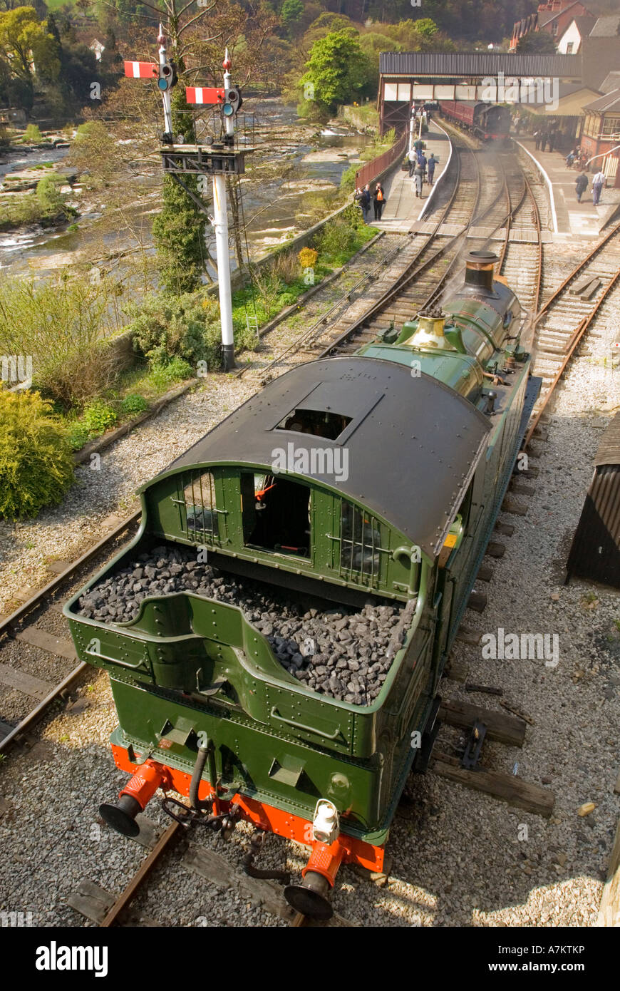 A tank engine waits at Llangollen heritage railway station in the Dee ...