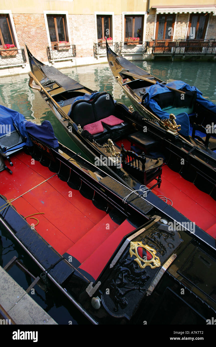 Close up details of Venetian gondola showing bright red trim and brass ...
