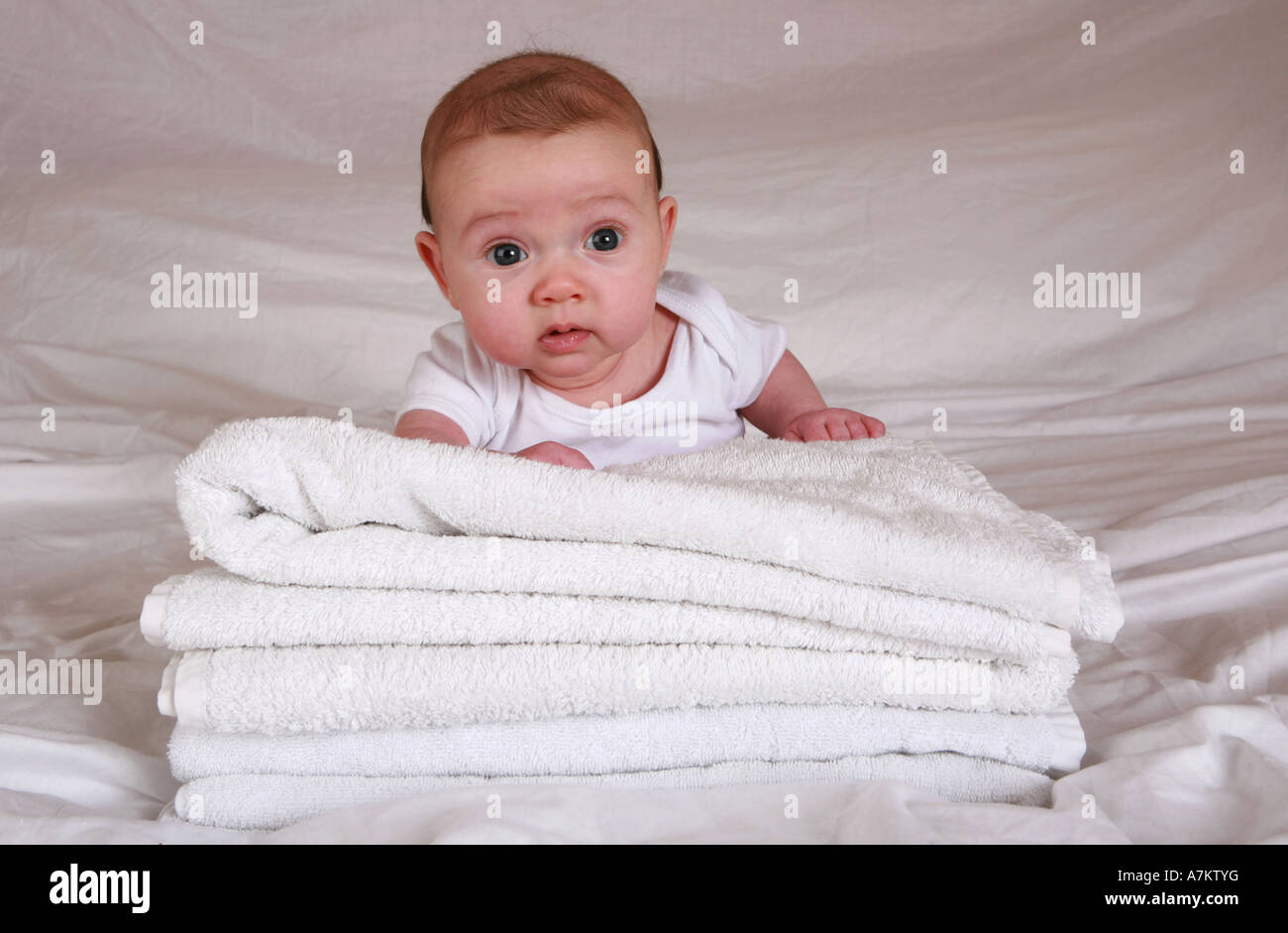 Gorgeous cute young newborn baby infant with large blue lovable ...