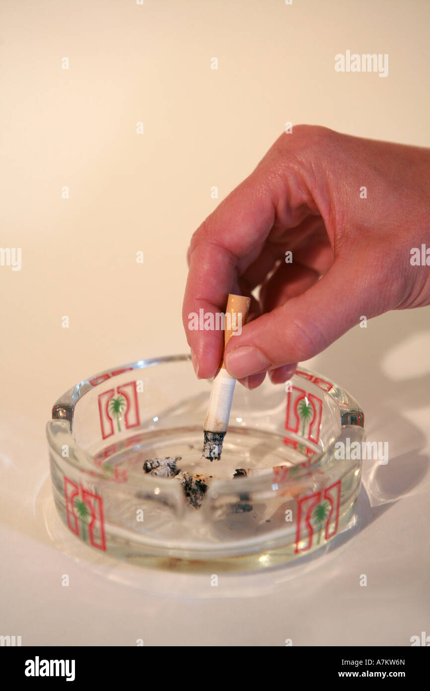 A half smoked cigarette is stubbed out and extinguished by a quitting ...