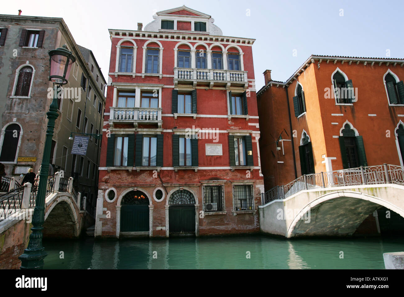 Traditional Venetian town house next to a typical backwater canal with ...