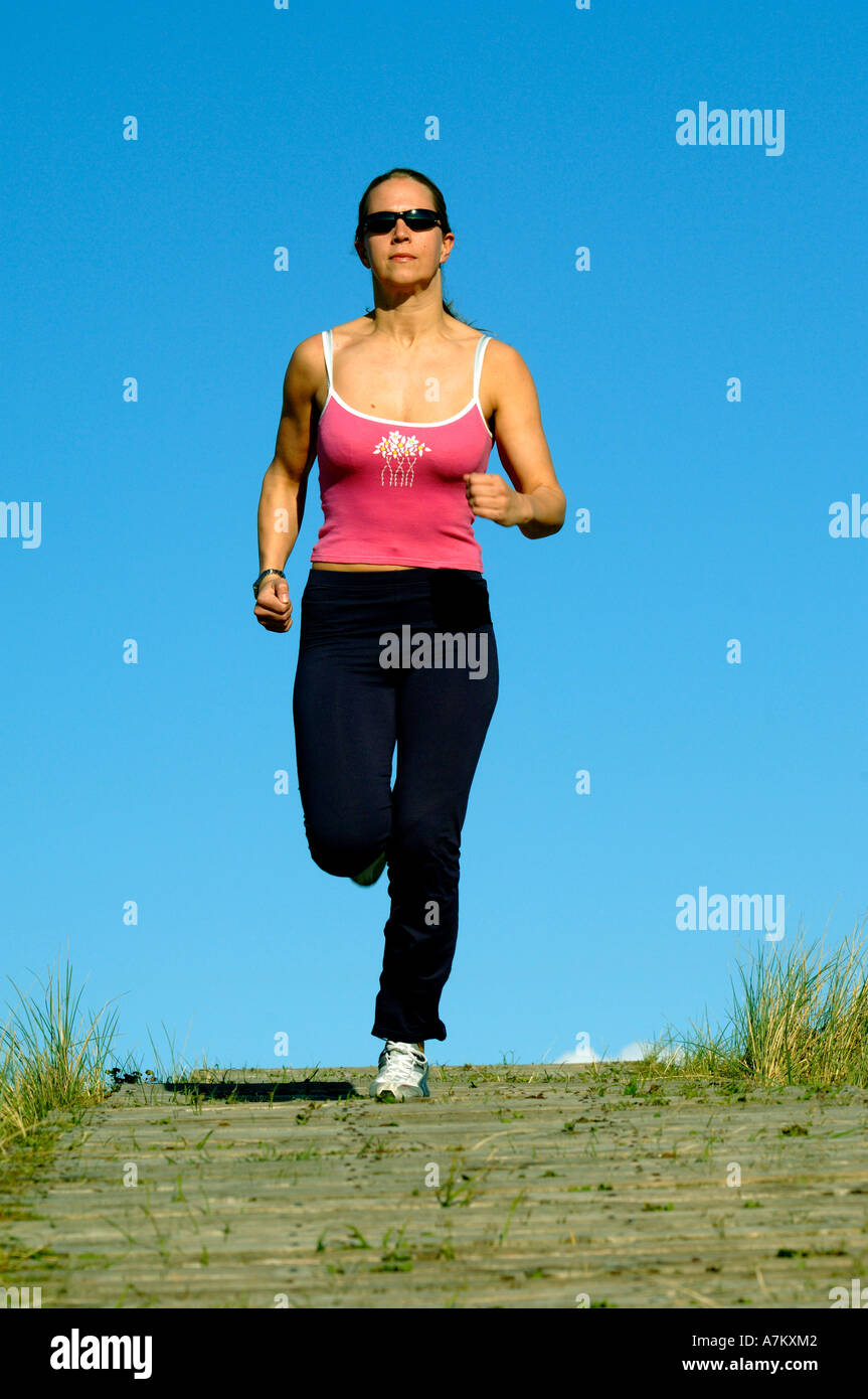 healthy young woman jogging keeping fit Stock Photo - Alamy