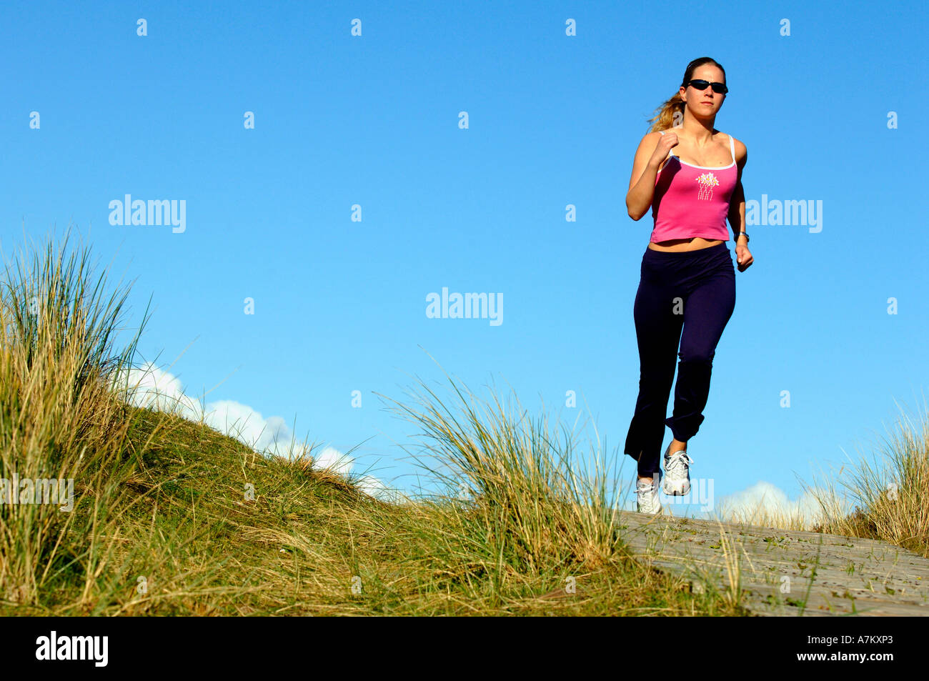 healthy young woman jogging keeping fit Stock Photo - Alamy