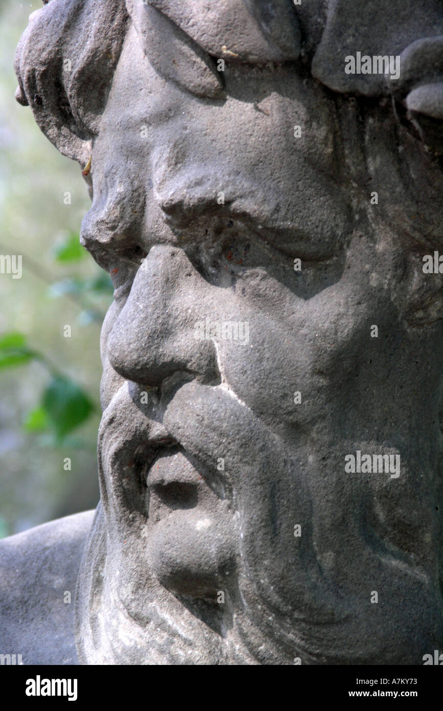 Statue of neptune carved from stone Stock Photo - Alamy