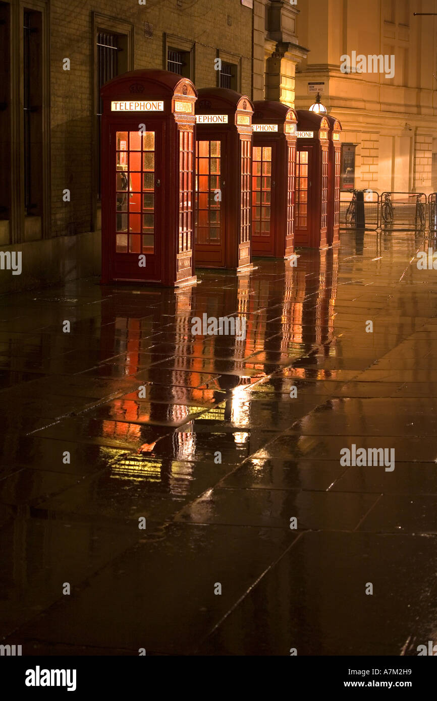 Row of old fashioned red telephone boxes in London England Stock Photo ...