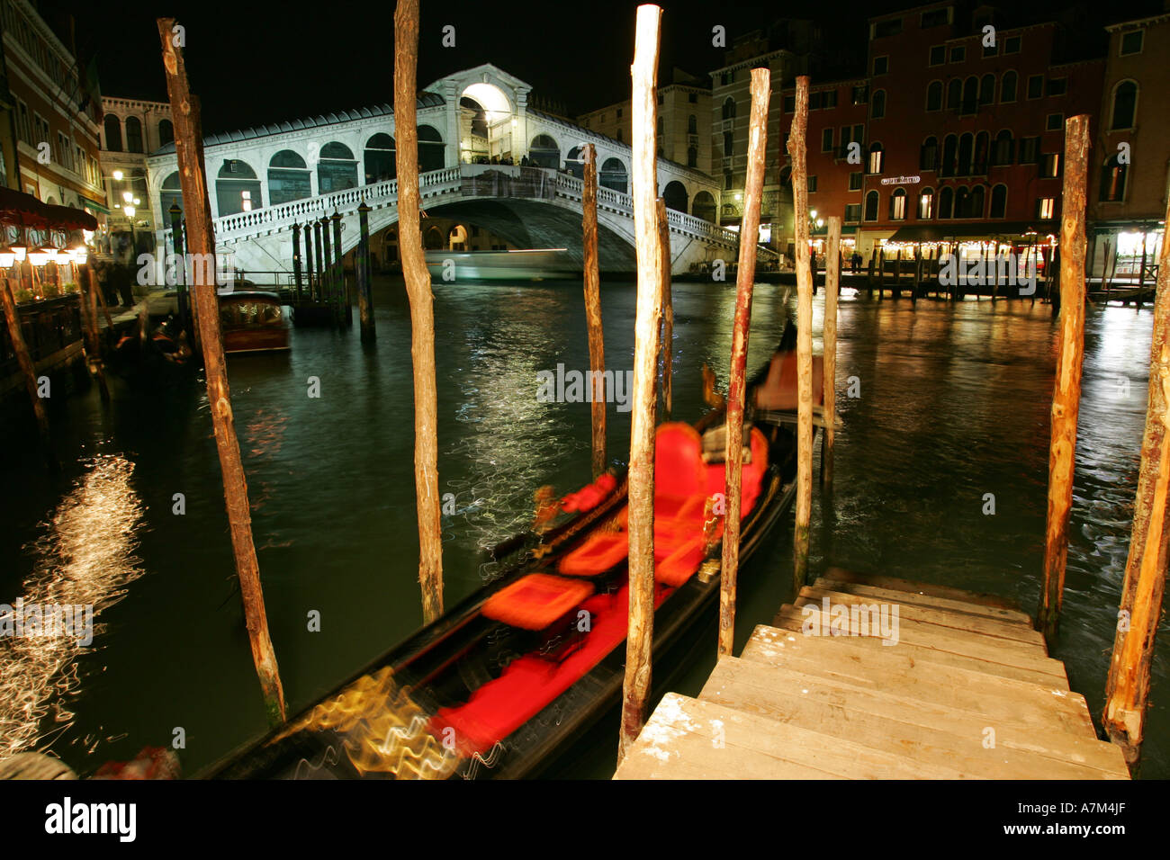 Night view of a moving Gondola on the Grand Canal with famous ...