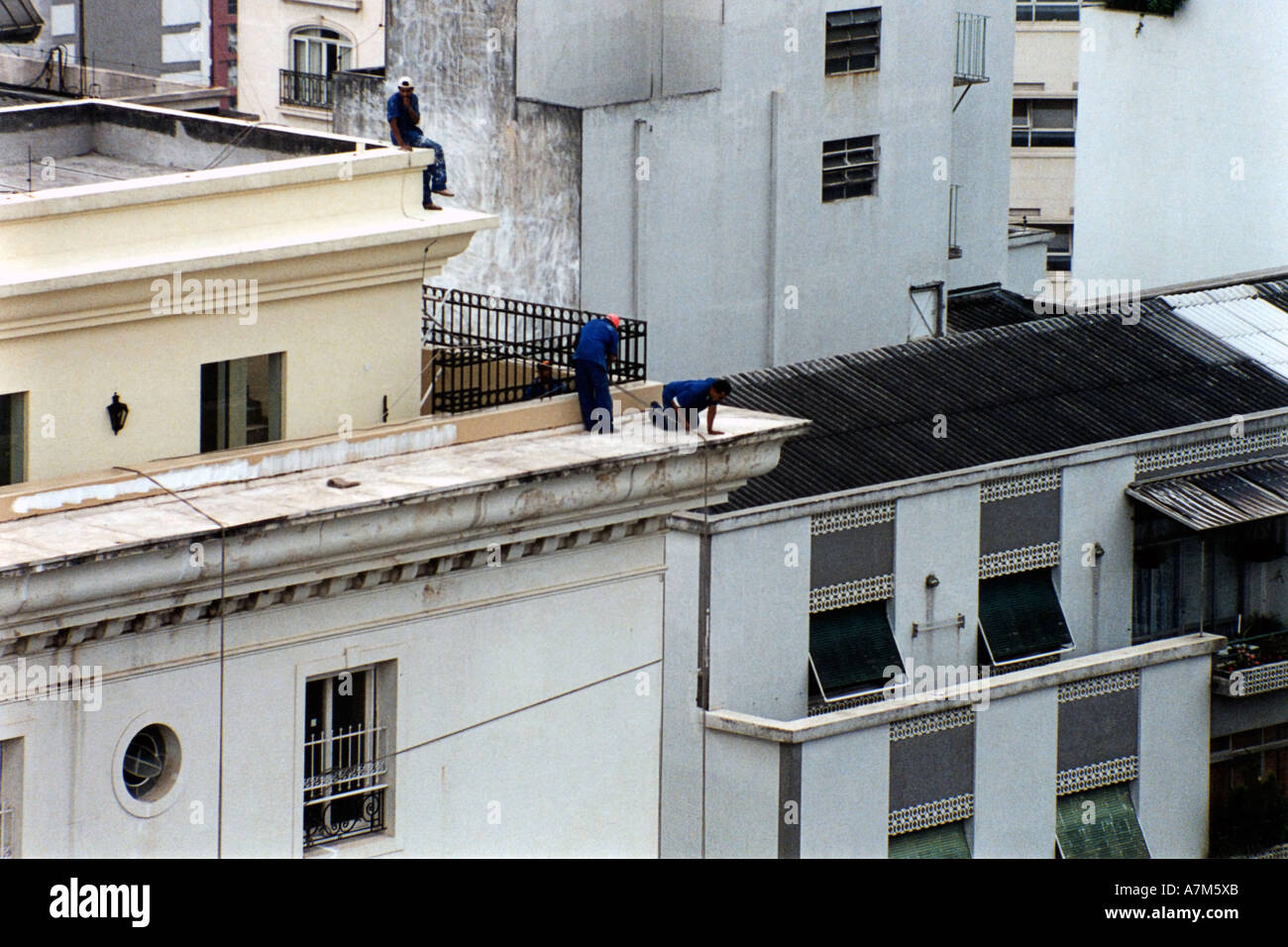 Dangerous Work and Safety Issue on top of a building Stock Photo - Alamy
