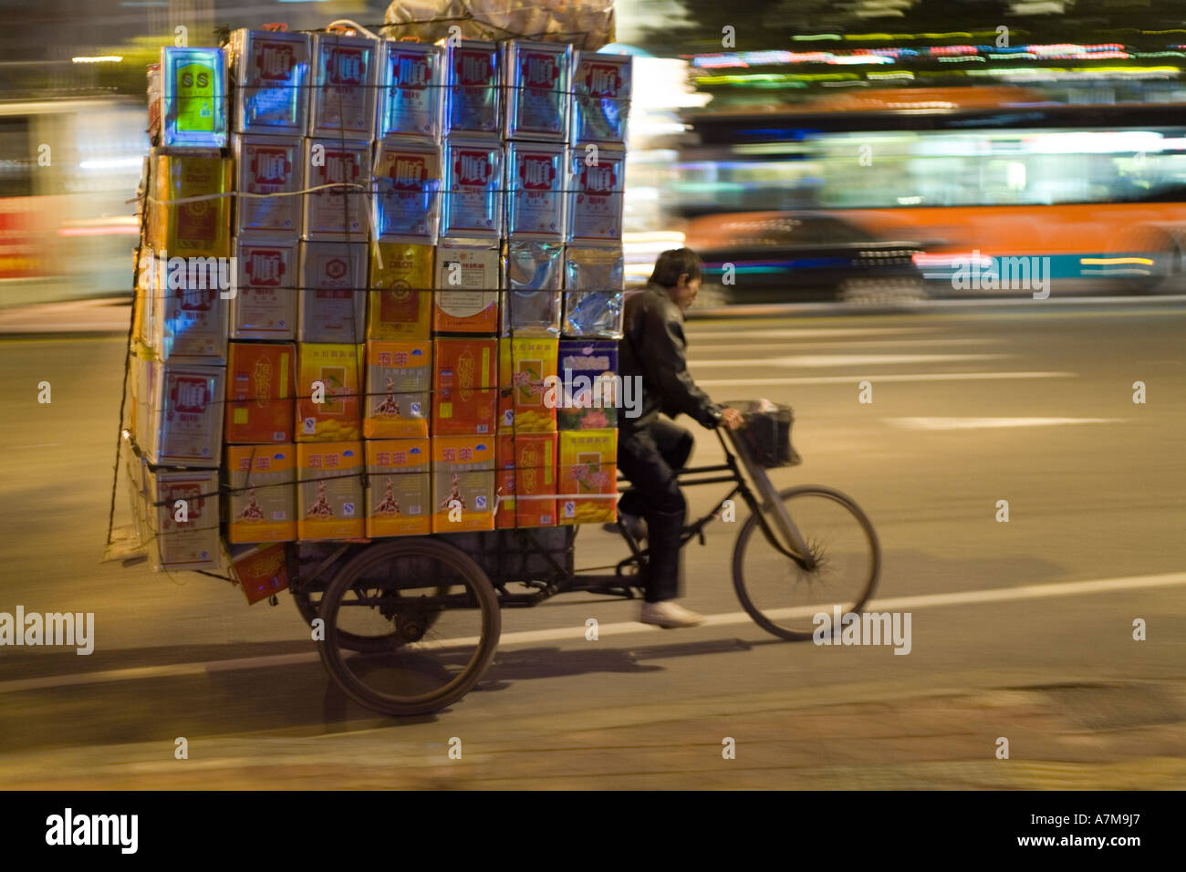Man transporting heavy load on bicycle Stock Photo - Alamy