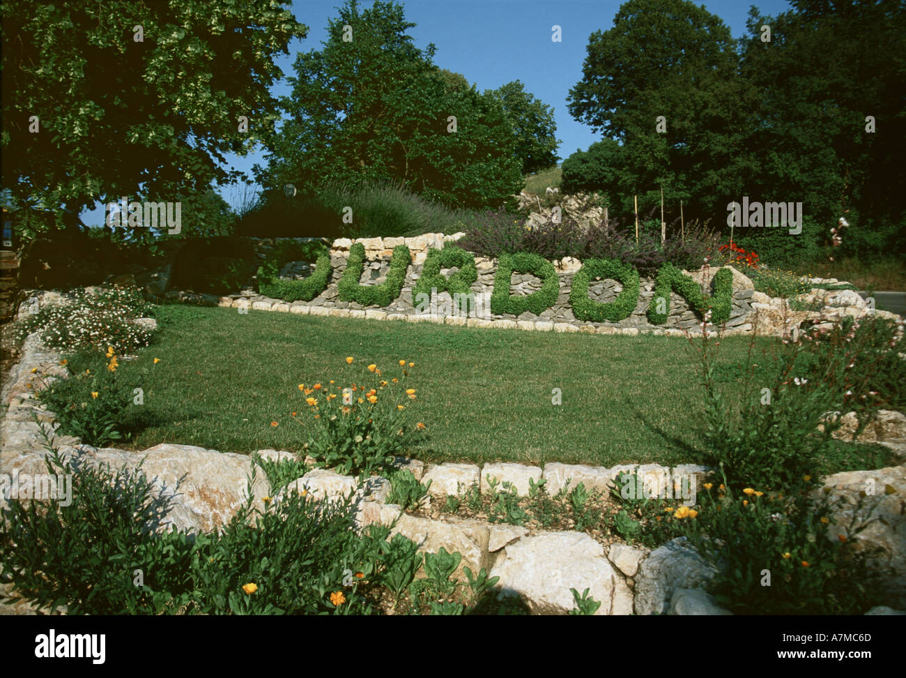 Floral entrance to the Plus Beau Village of Gourdon Stock Photo - Alamy