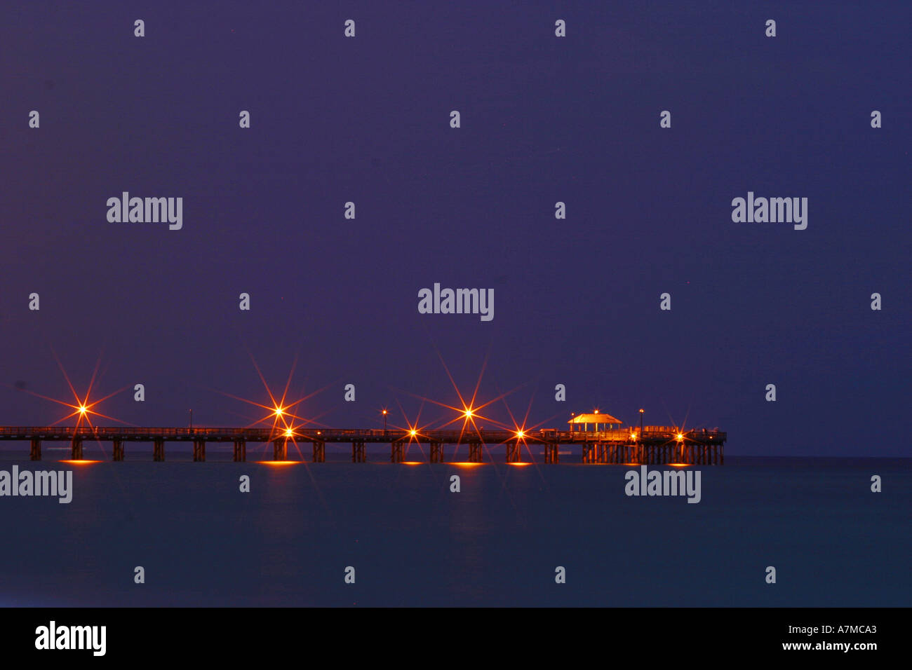 North Beach pier jetty illuminated at night night shot from the beach ...