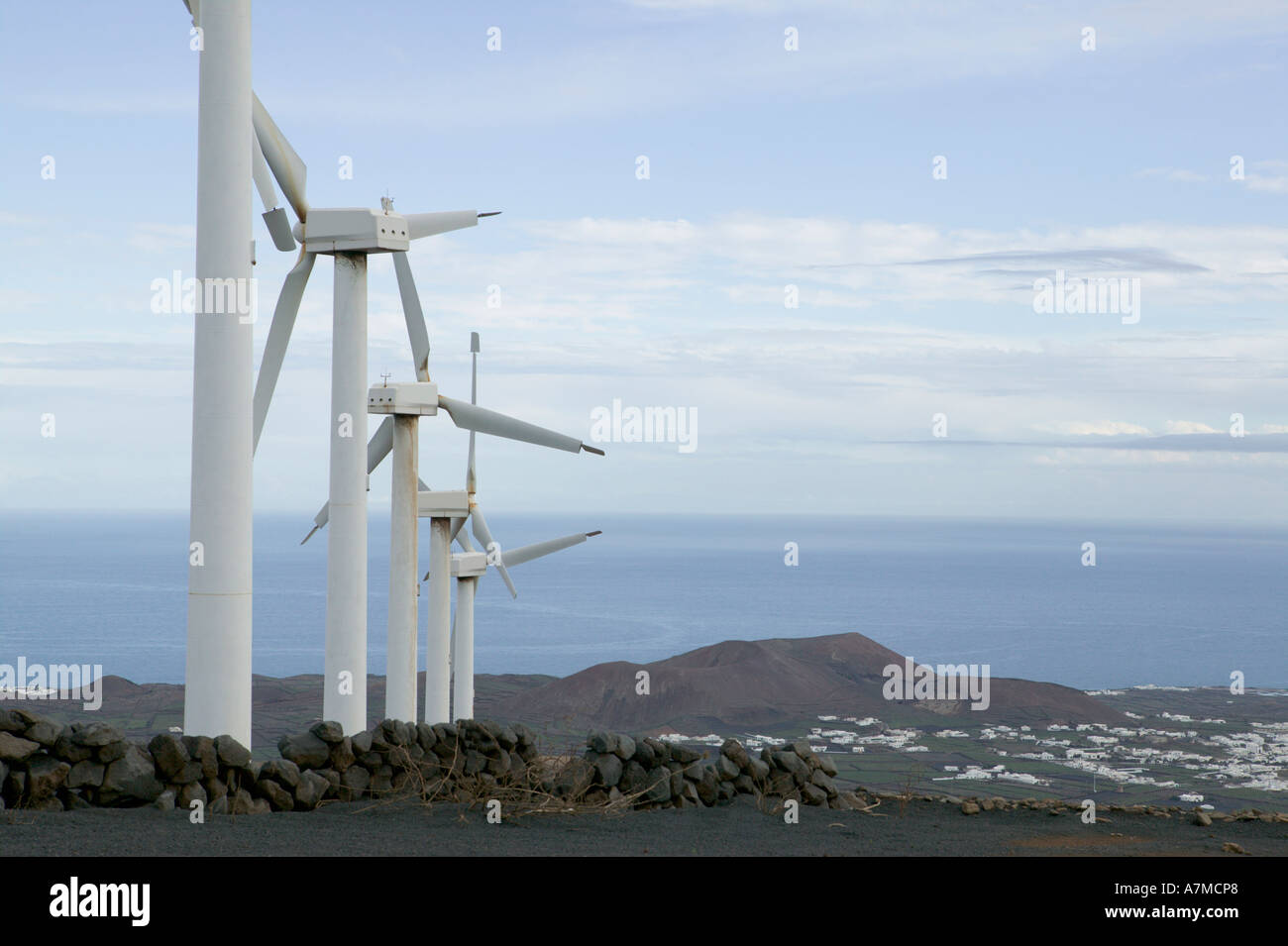 Row of wind turbines on hill Stock Photo - Alamy