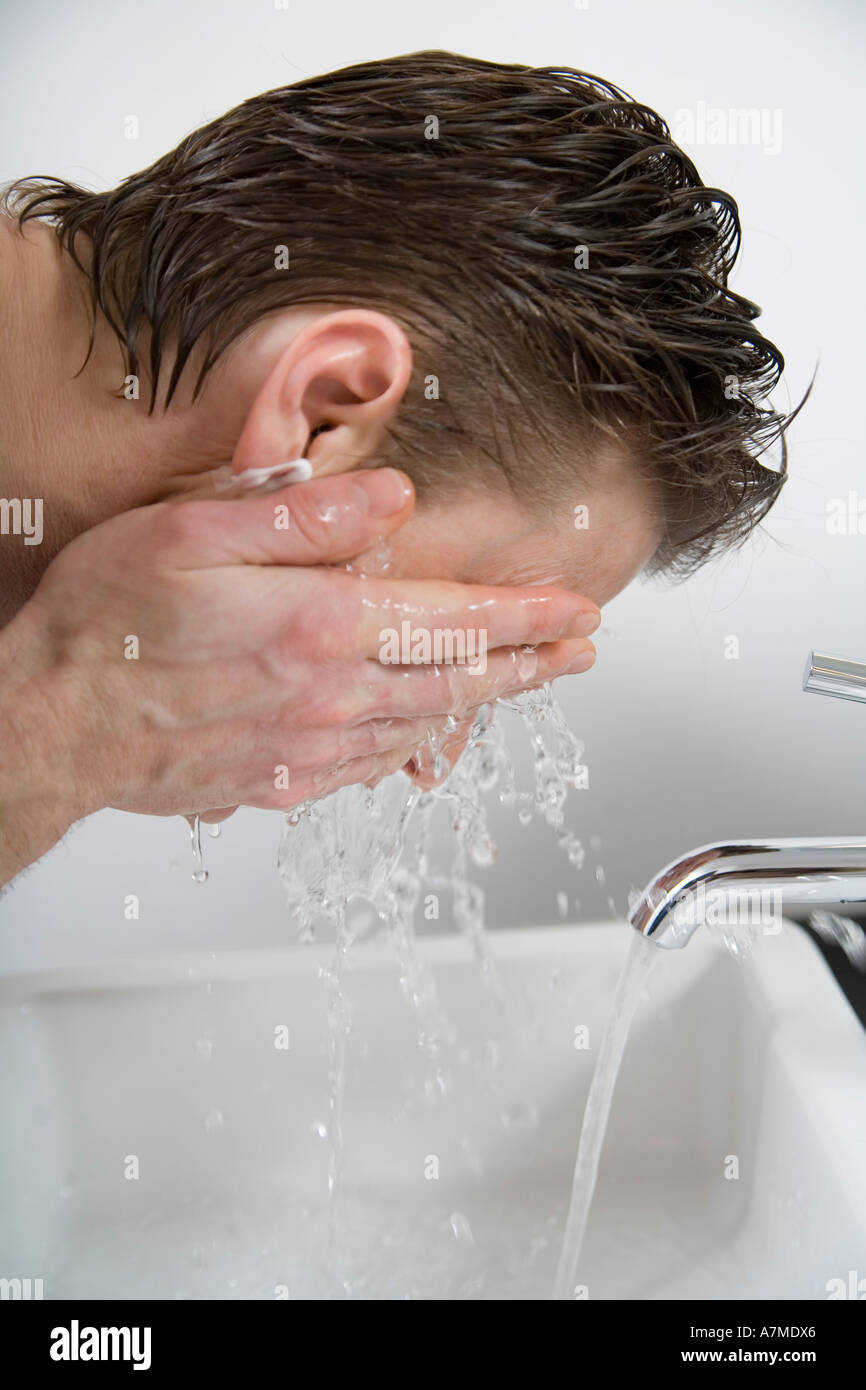 Man rinsing face hi-res stock photography and images - Alamy