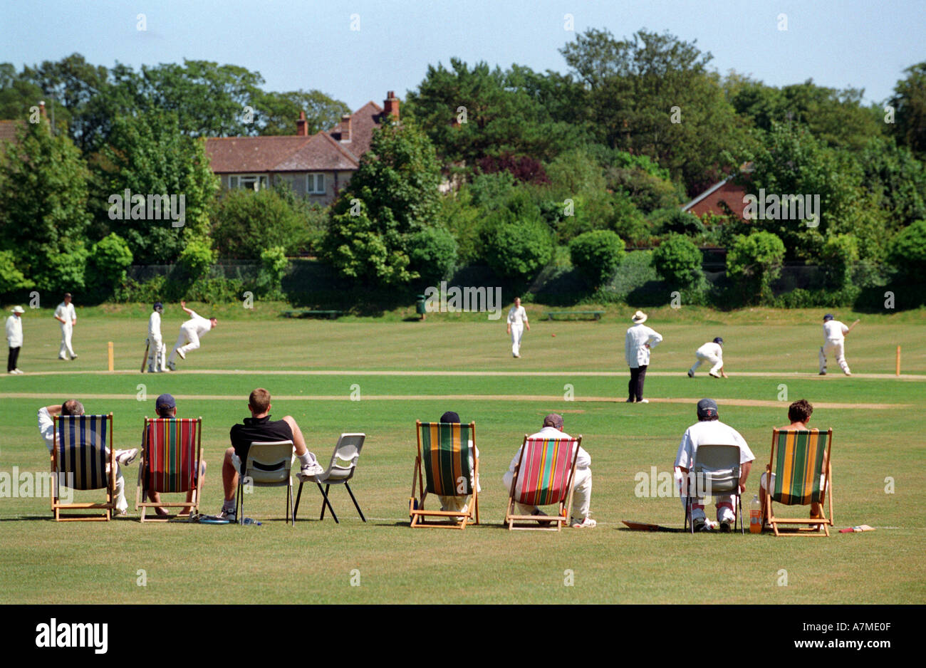 Cricket spectators watch village cricket hi-res stock photography and ...