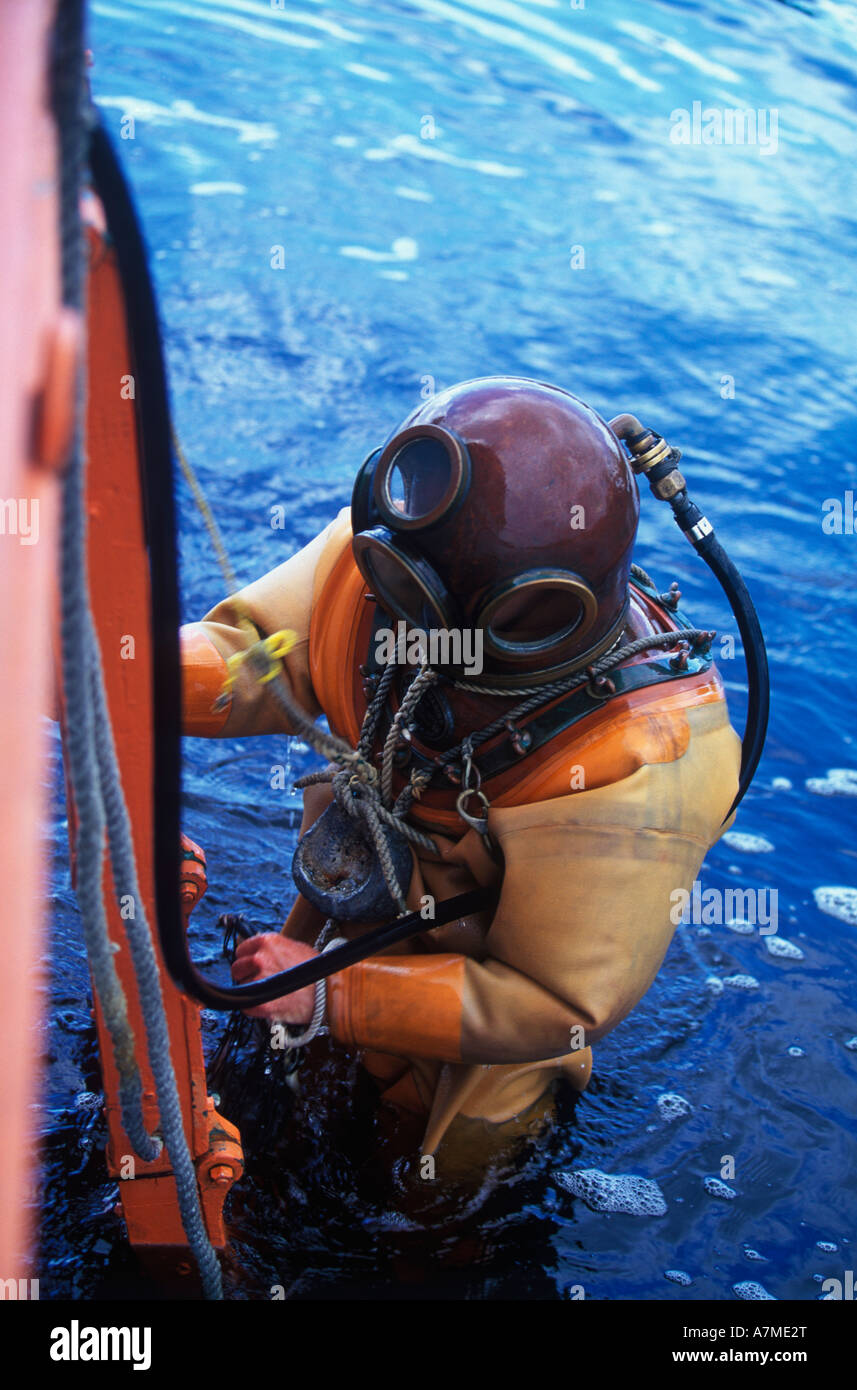 An exhibition sponge diver climbs up a ladder back on board the St ...