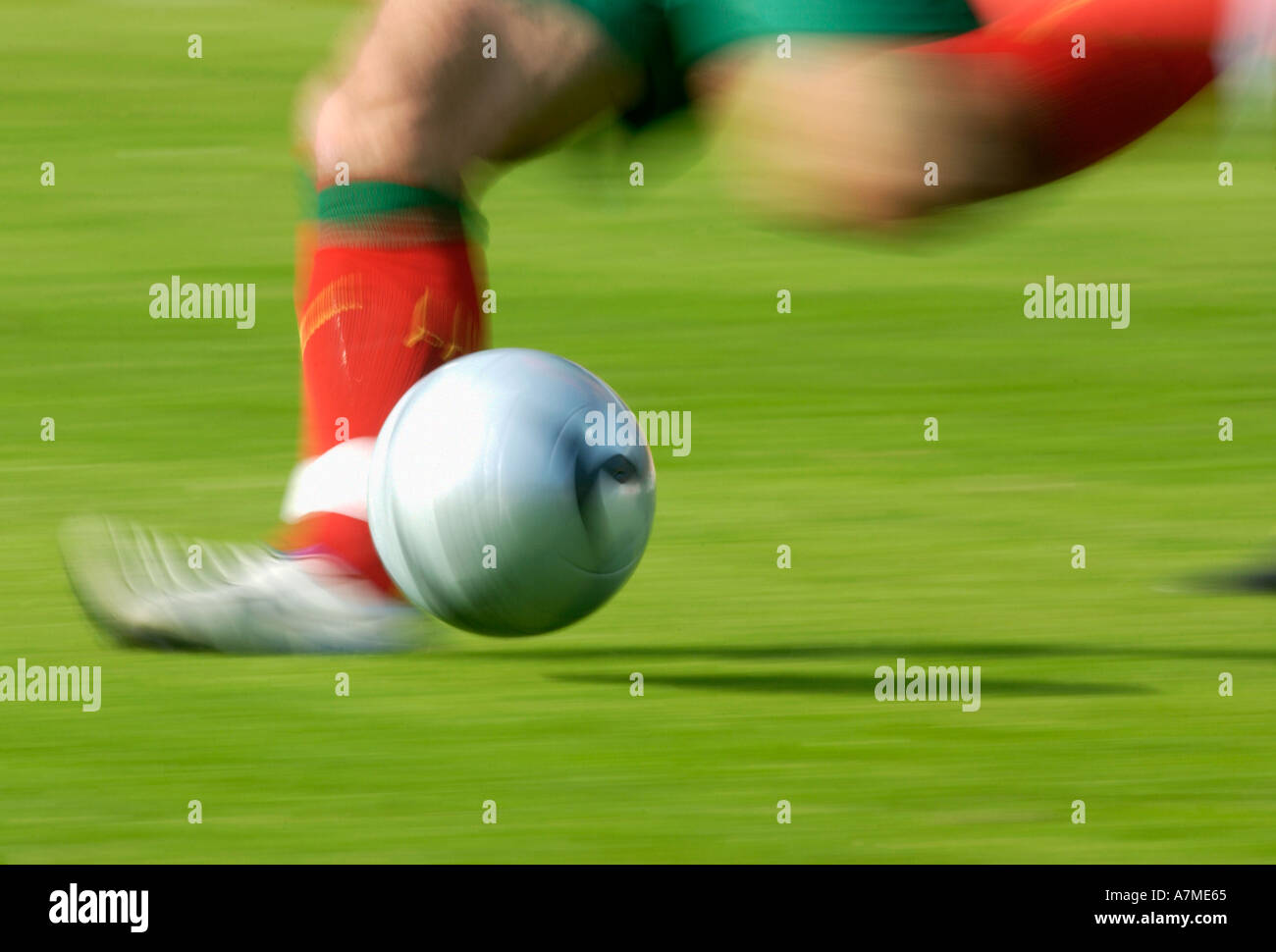 legs of a soccer player with ball Stock Photo - Alamy