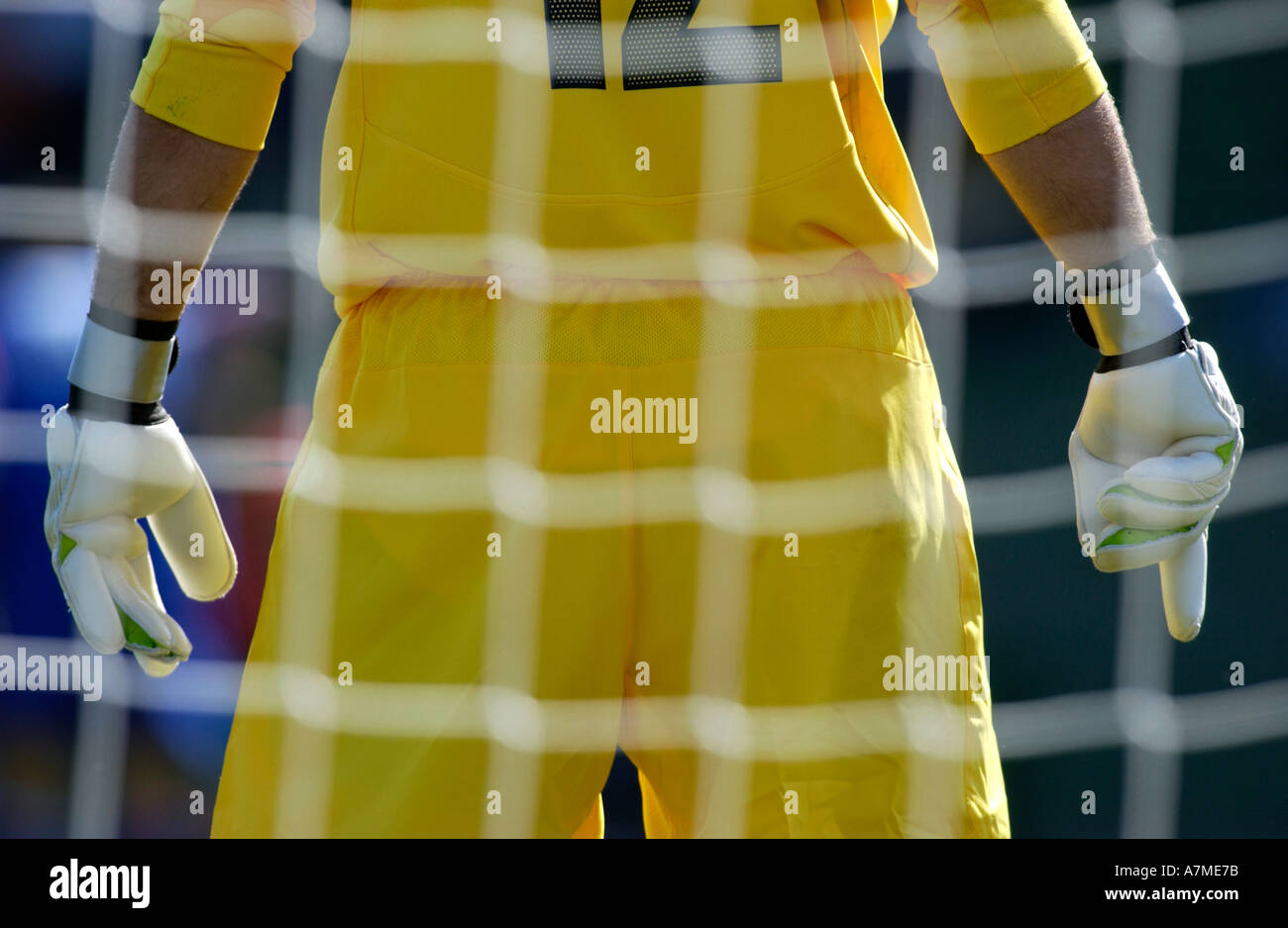 detail of a soccer goalie in yellow clothes Stock Photo - Alamy