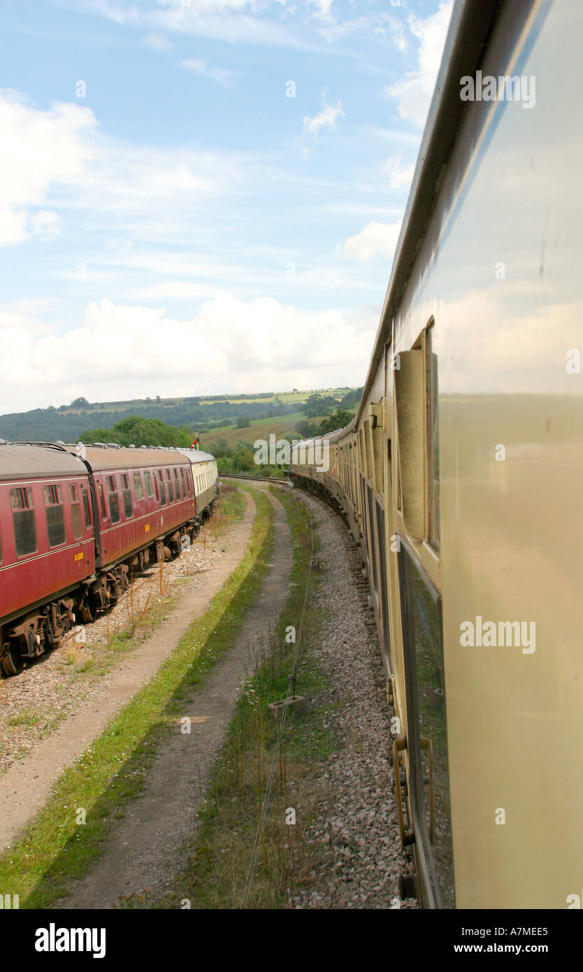 Steam train taking curve viewed from compartment window Stock Photo - Alamy