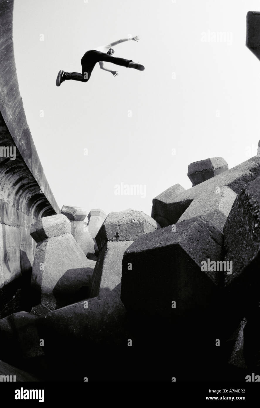 Young man jumping over railing hi-res stock photography and images - Alamy