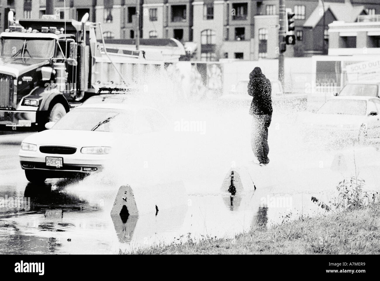 Puddle pedestrian car splash hi-res stock photography and images - Alamy