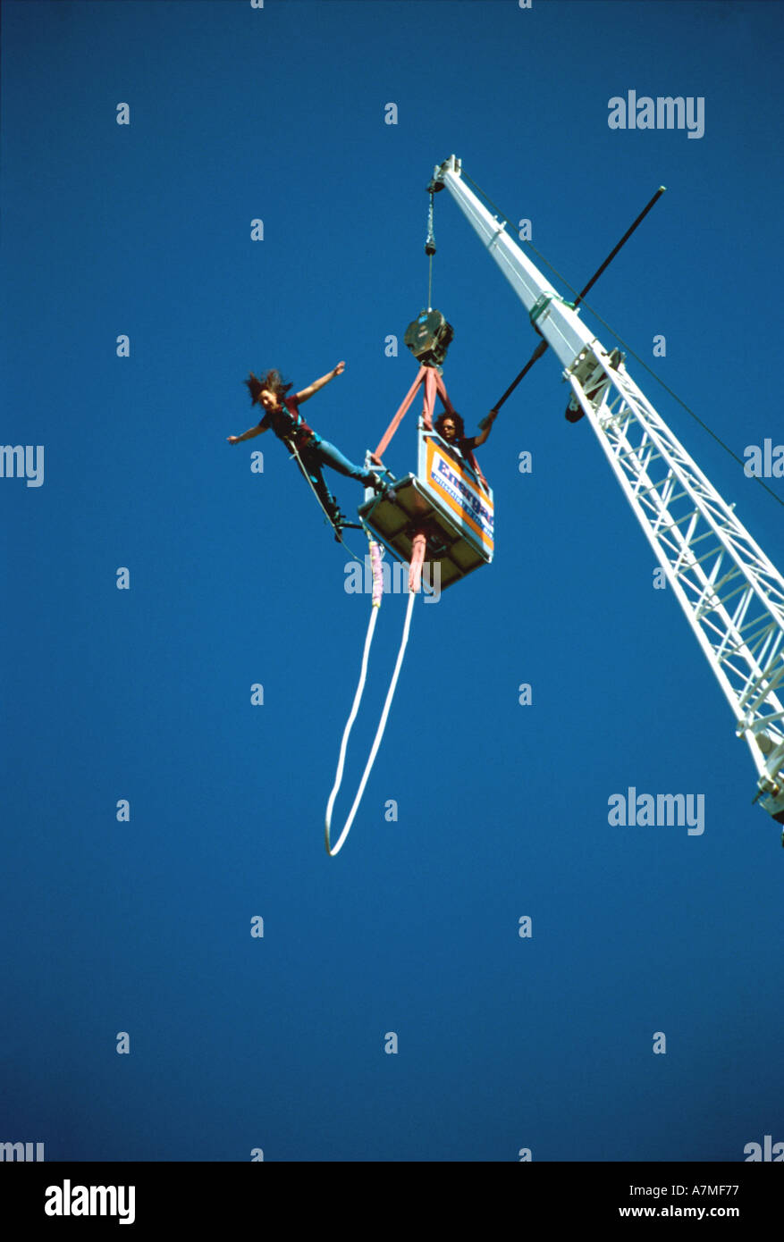 woman doing bungee jump off a crane Stock Photo - Alamy