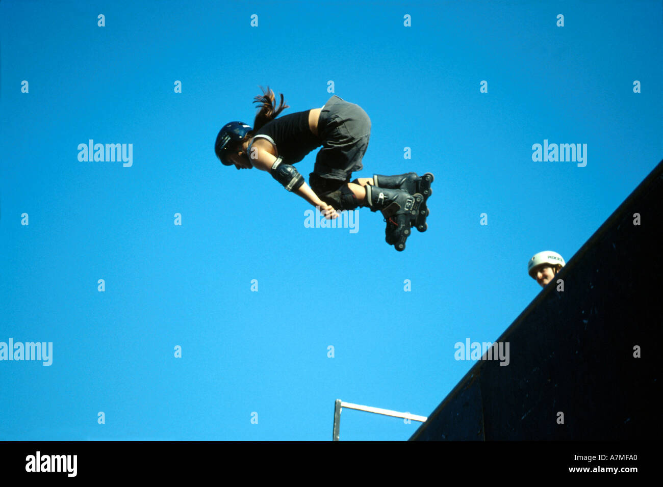 girl rollerblader in action on ramp Stock Photo - Alamy