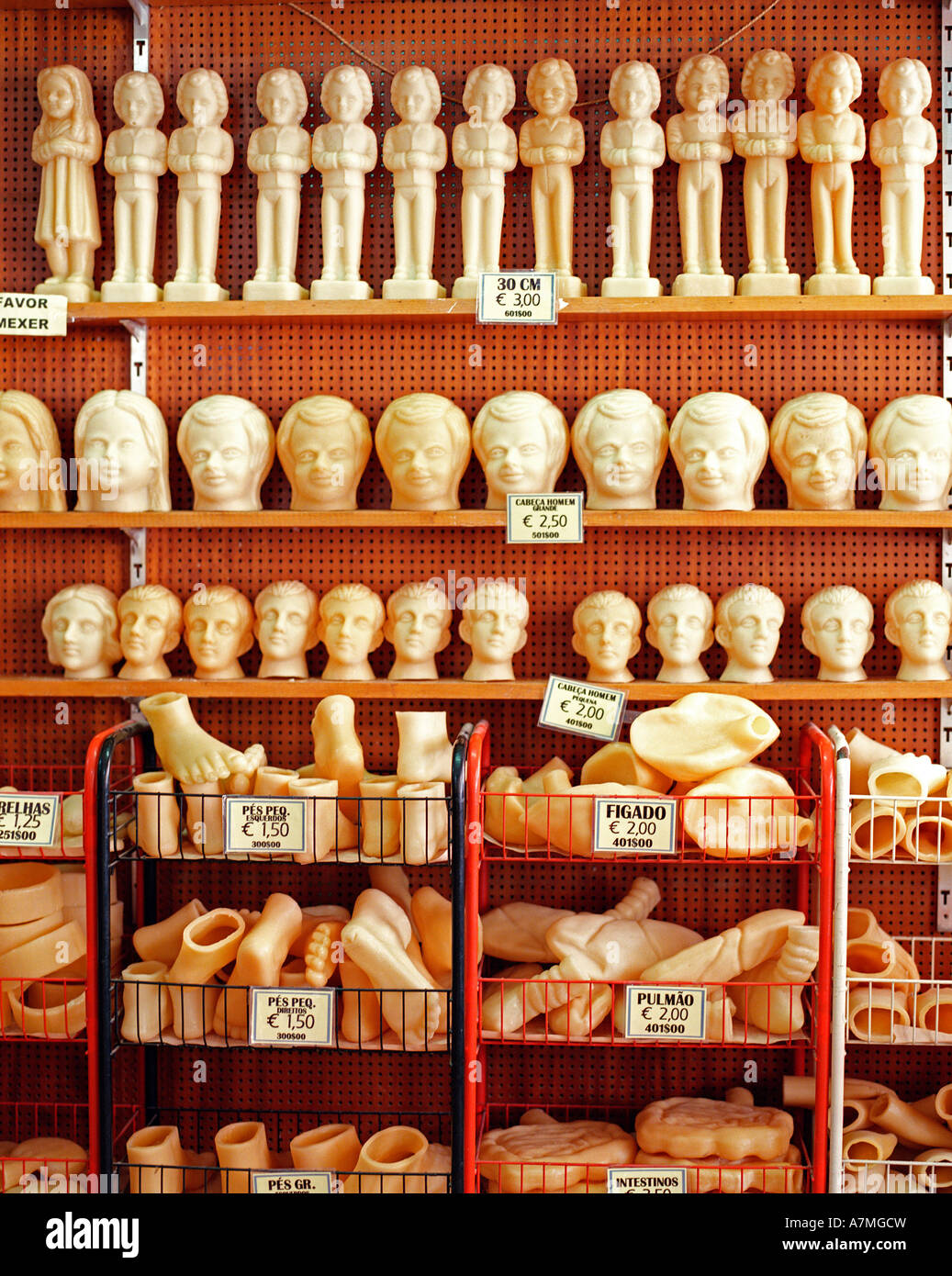 A souvenir shop in Fatima filled with candles in the shape of children ...