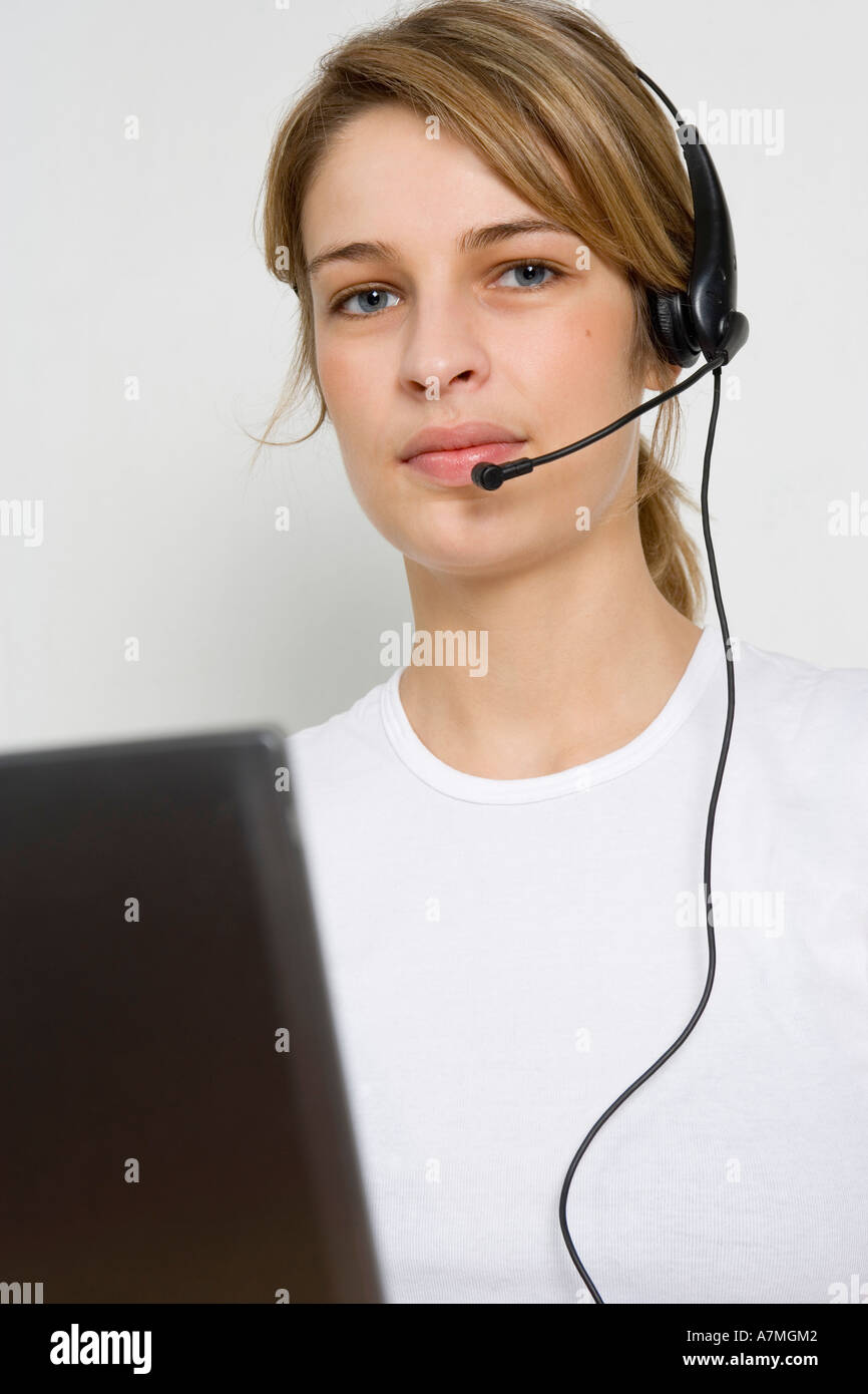 A woman wearing a headset Stock Photo - Alamy