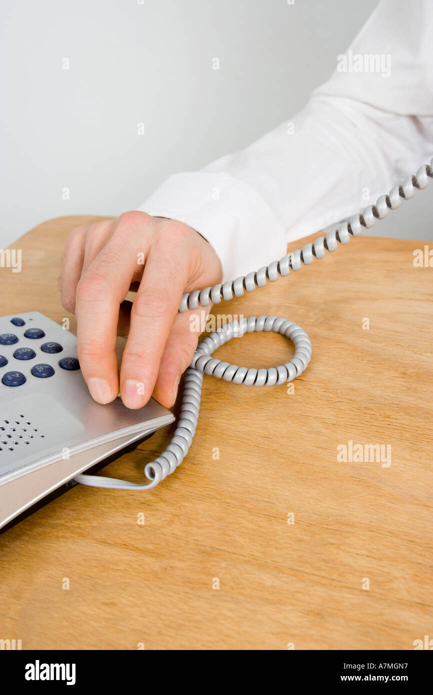 A man holding a telephone cord Stock Photo - Alamy