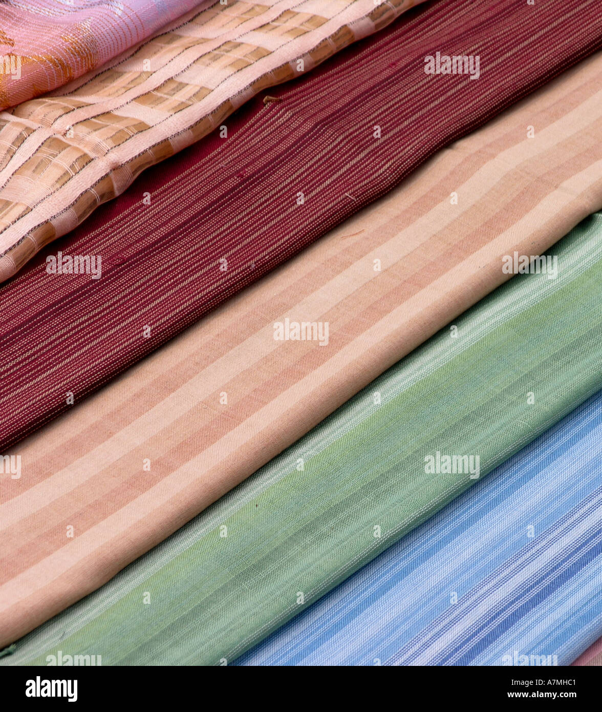 Multi coloured fabric folded Stock Photo - Alamy