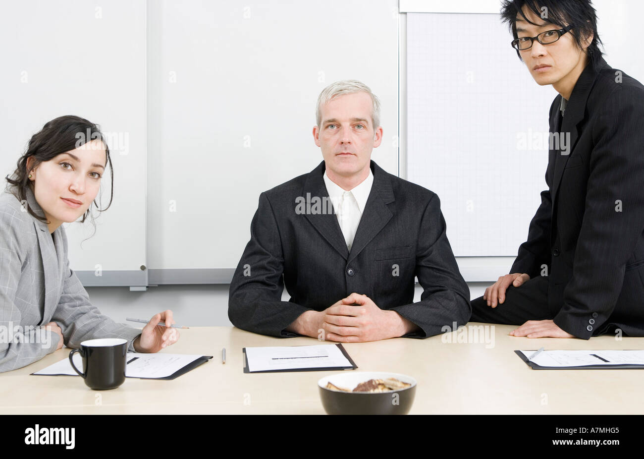 Three businesspeople in a conference room Stock Photo - Alamy