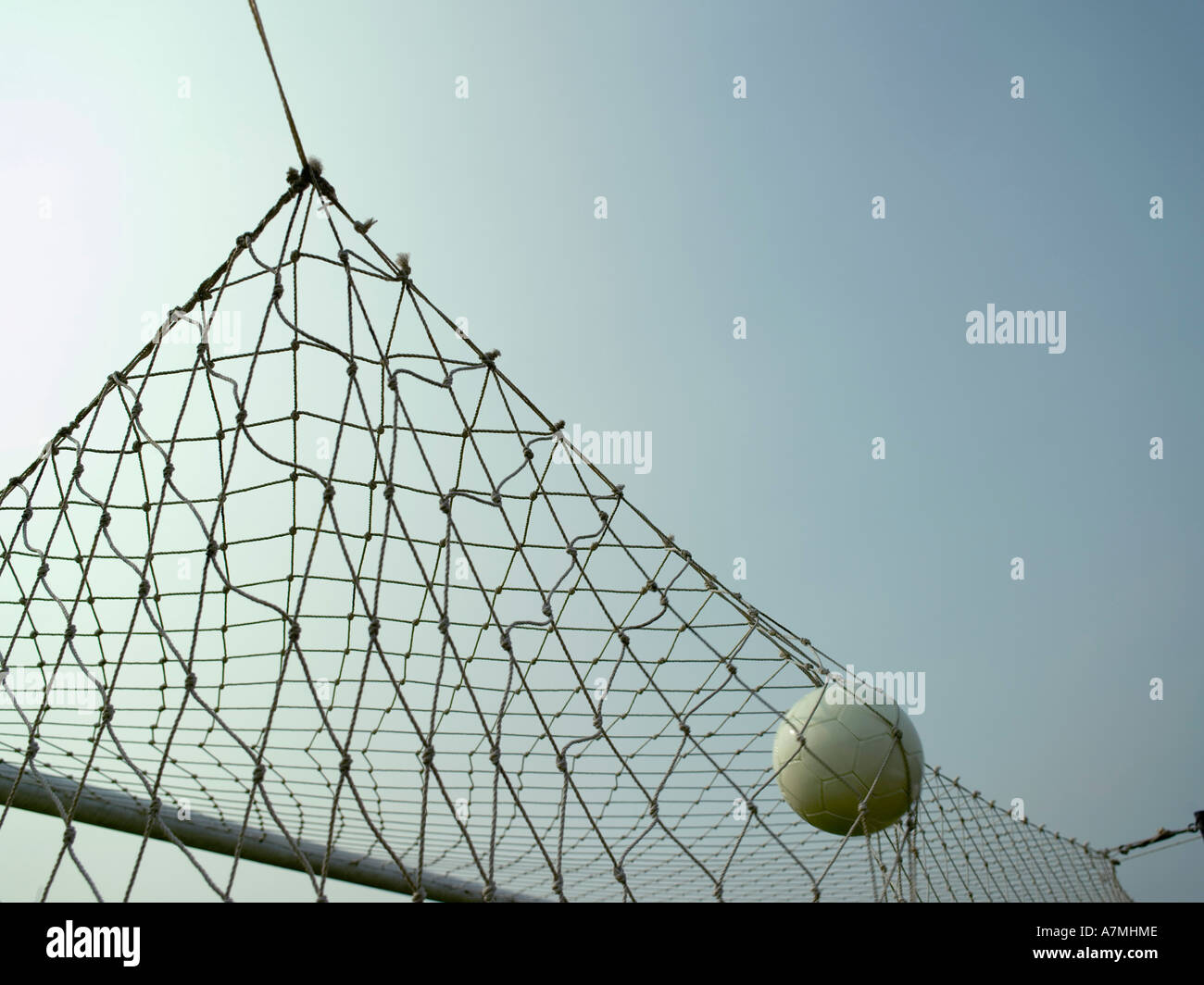 A soccer ball in a goal Stock Photo - Alamy