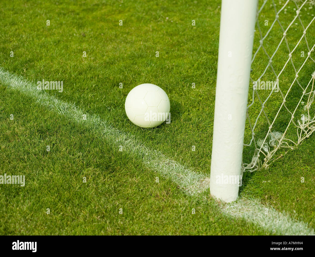 Soccer ball near goal post hi-res stock photography and images - Alamy