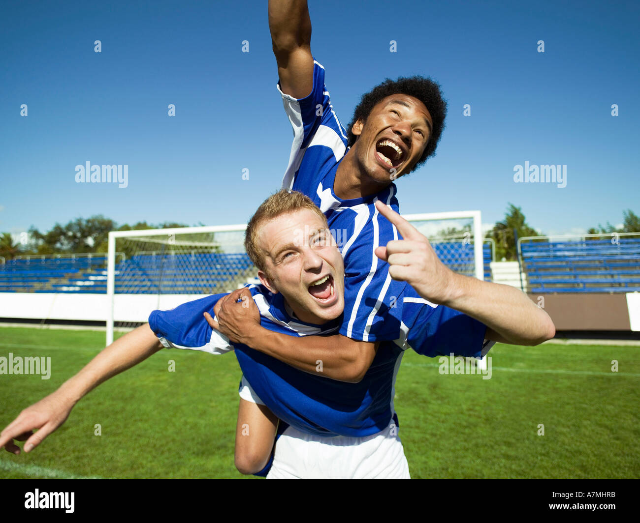 Two soccer players celebrating Stock Photo - Alamy