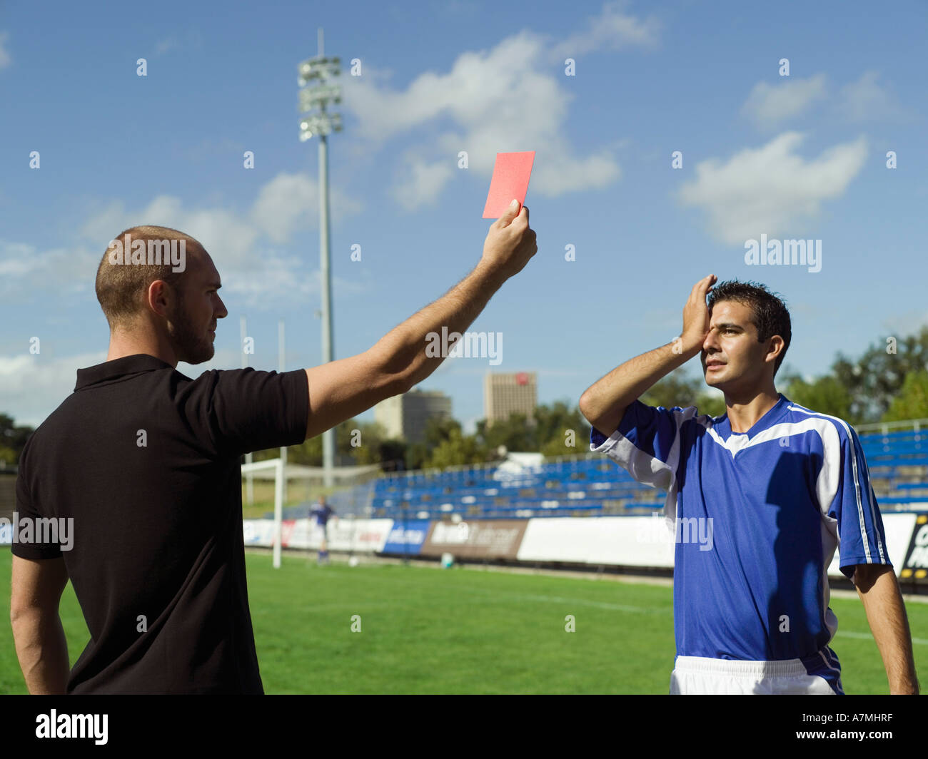 A soccer player being given a red card Stock Photo - Alamy