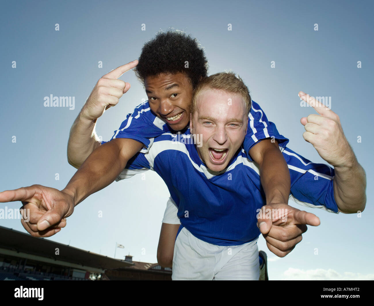 Two soccer players celebrating Stock Photo - Alamy