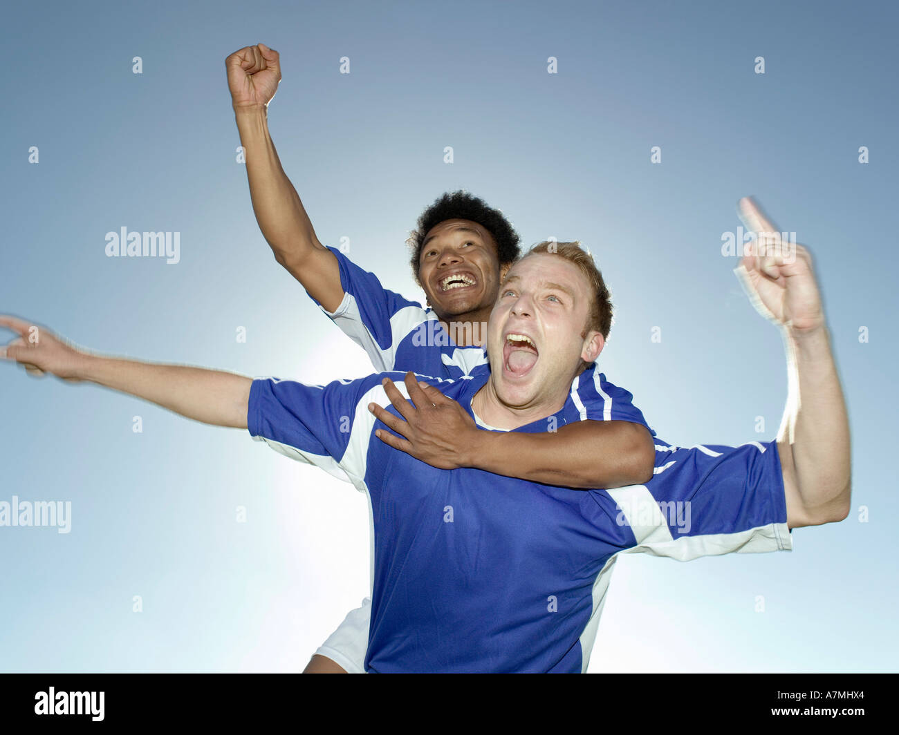 Two soccer players celebrating Stock Photo - Alamy