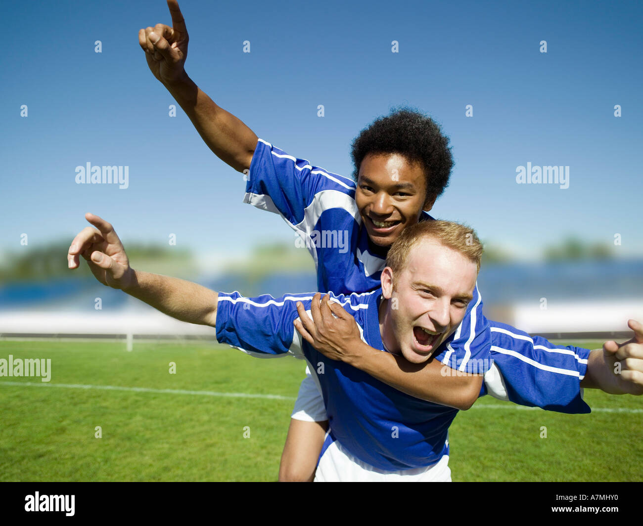 Two soccer players celebrating Stock Photo - Alamy