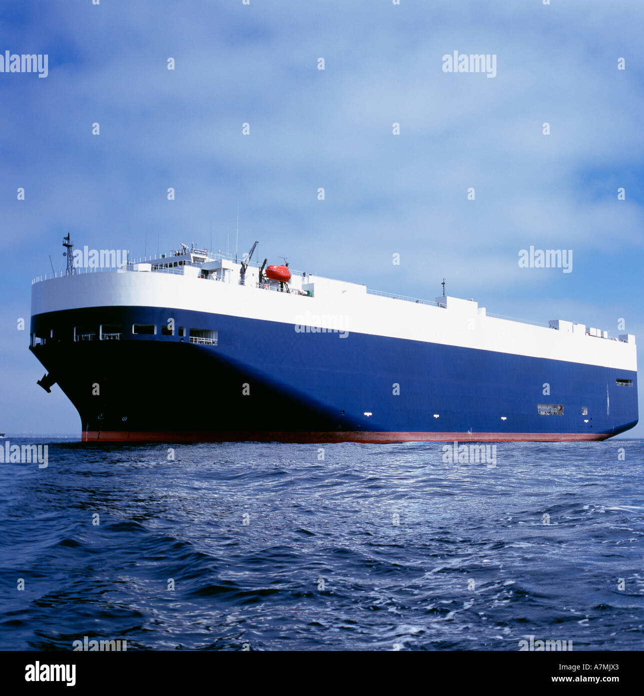 Cargo ship sailing at sea Stock Photo - Alamy